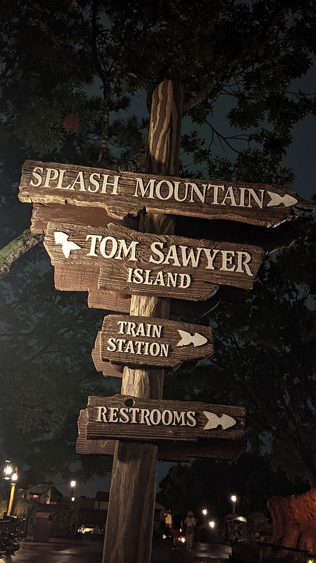 Frontierland Signs After Dark Vertical – KennythePirate.com